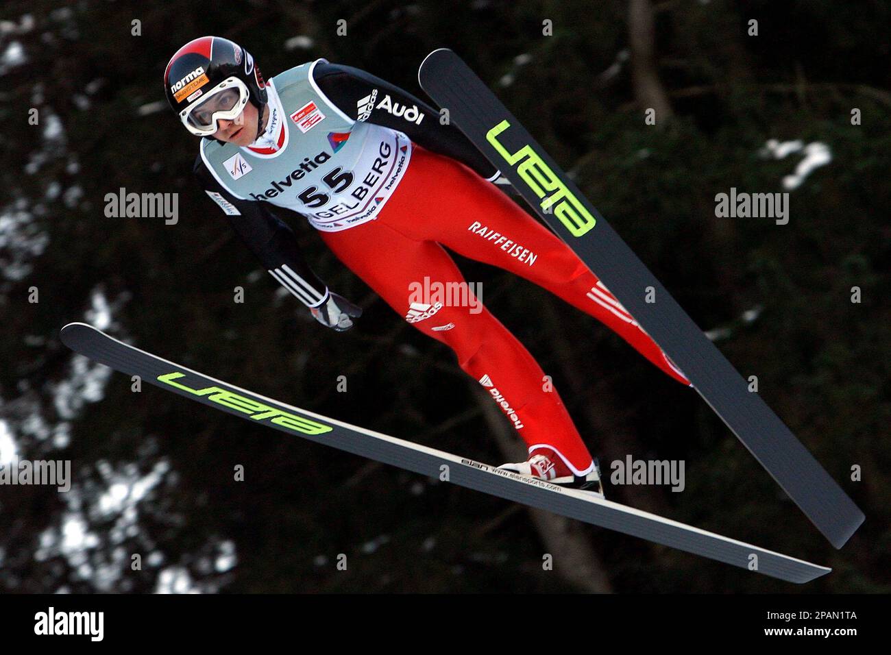 Simon Ammann of Switzerland soars through the air at the FIS Ski ...