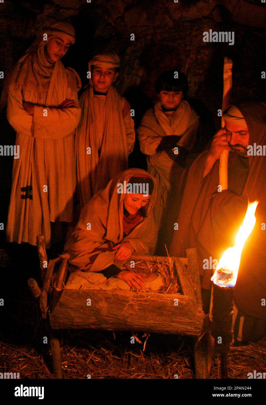 Israeli Arab Christians and foreigners gather at a Nativity scene ...