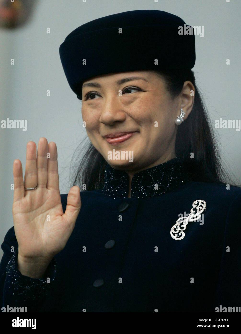 Japan's Crown Princess Masako waves from a bulletproof balcony at ...