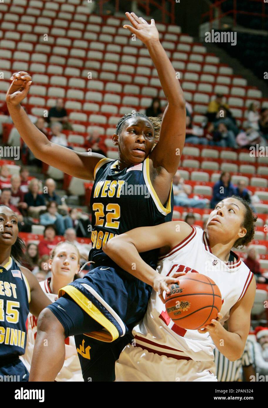 Indiana forward Whitney Thomas (11) is fouled by West Virginia forward ...