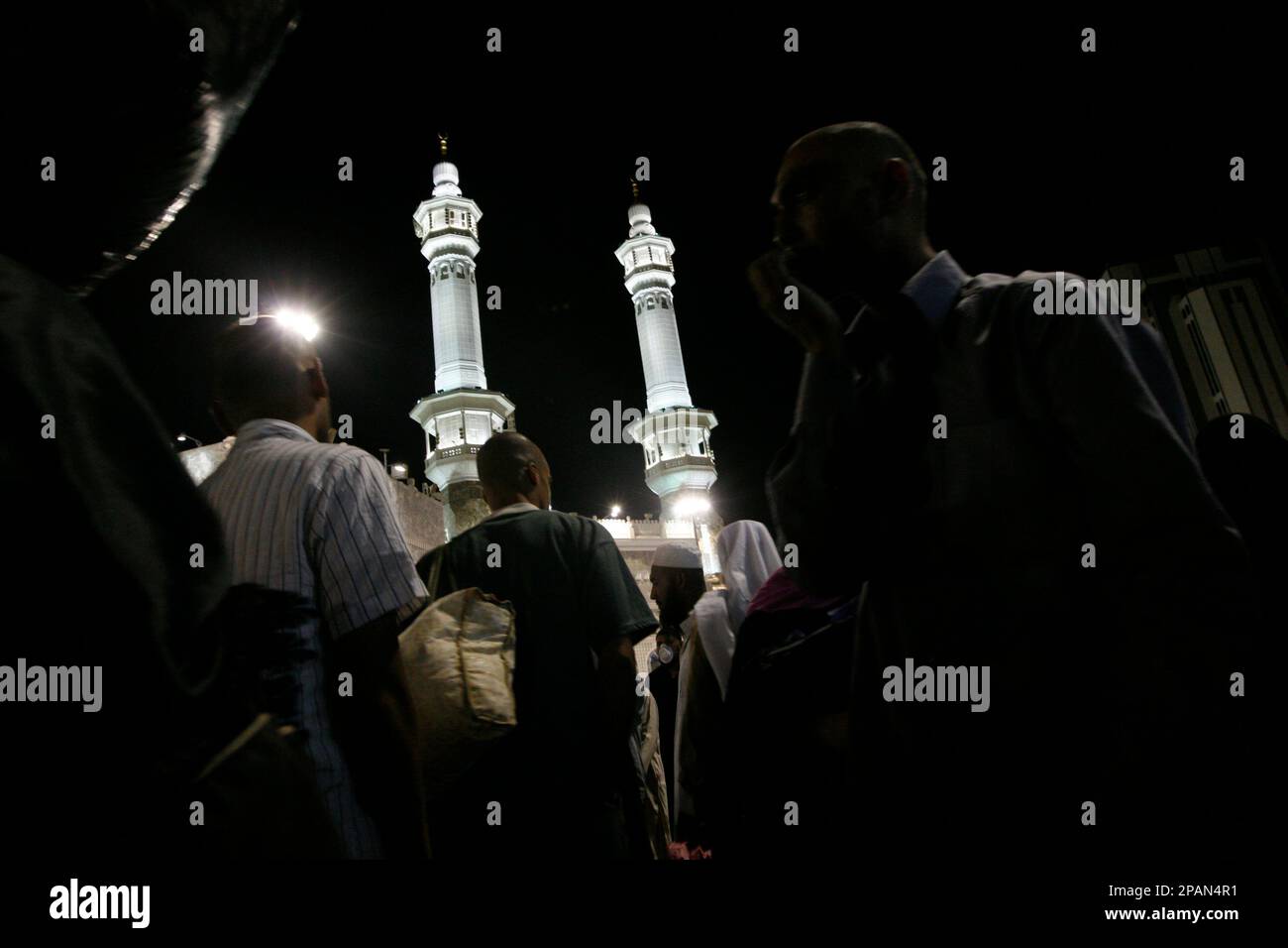 Muslim pilgrims walk pass outside of the Grand mosque after they ...