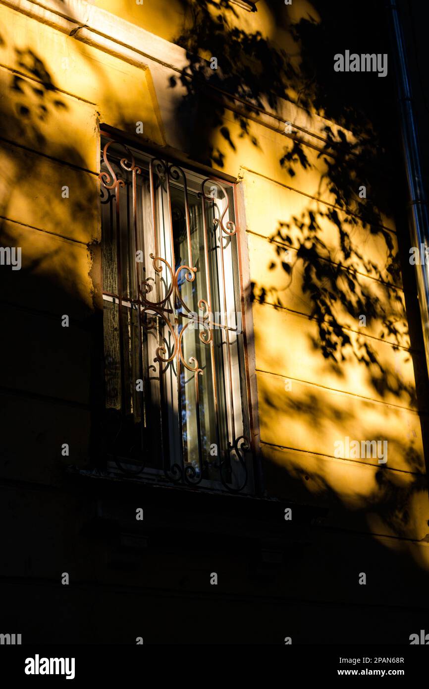 A beautiful play of light and shadow on the facade of the yellow ...