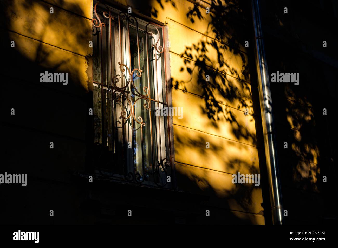 A beautiful play of light and shadow on the facade of the yellow ...