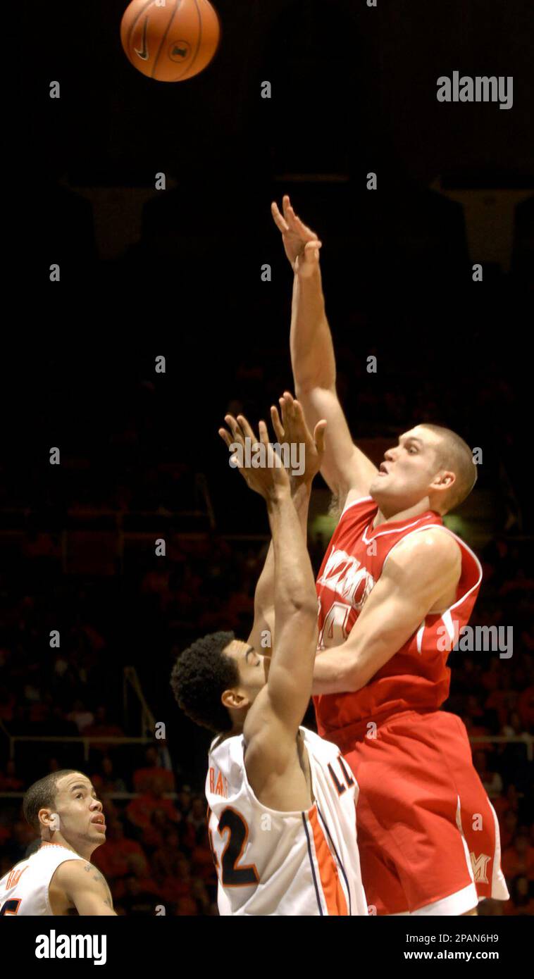 Miami of Ohio's Michael Bramos, left, puts up a shot over Illinois ...