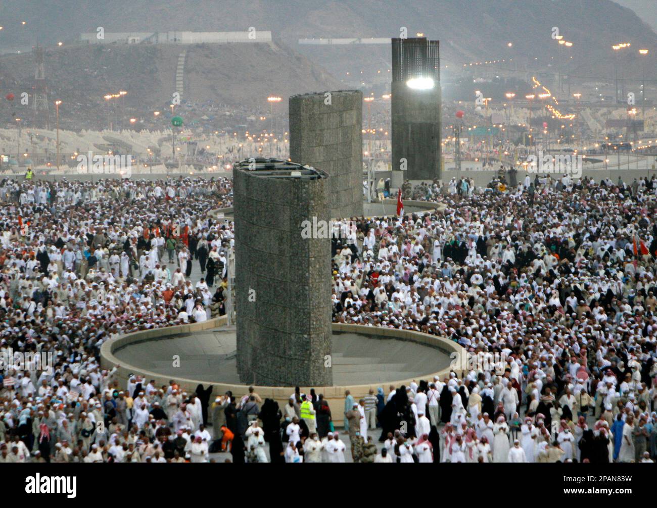 Muslim pilgrims perform the ritual "stoning of the devil" in Mina, in ...