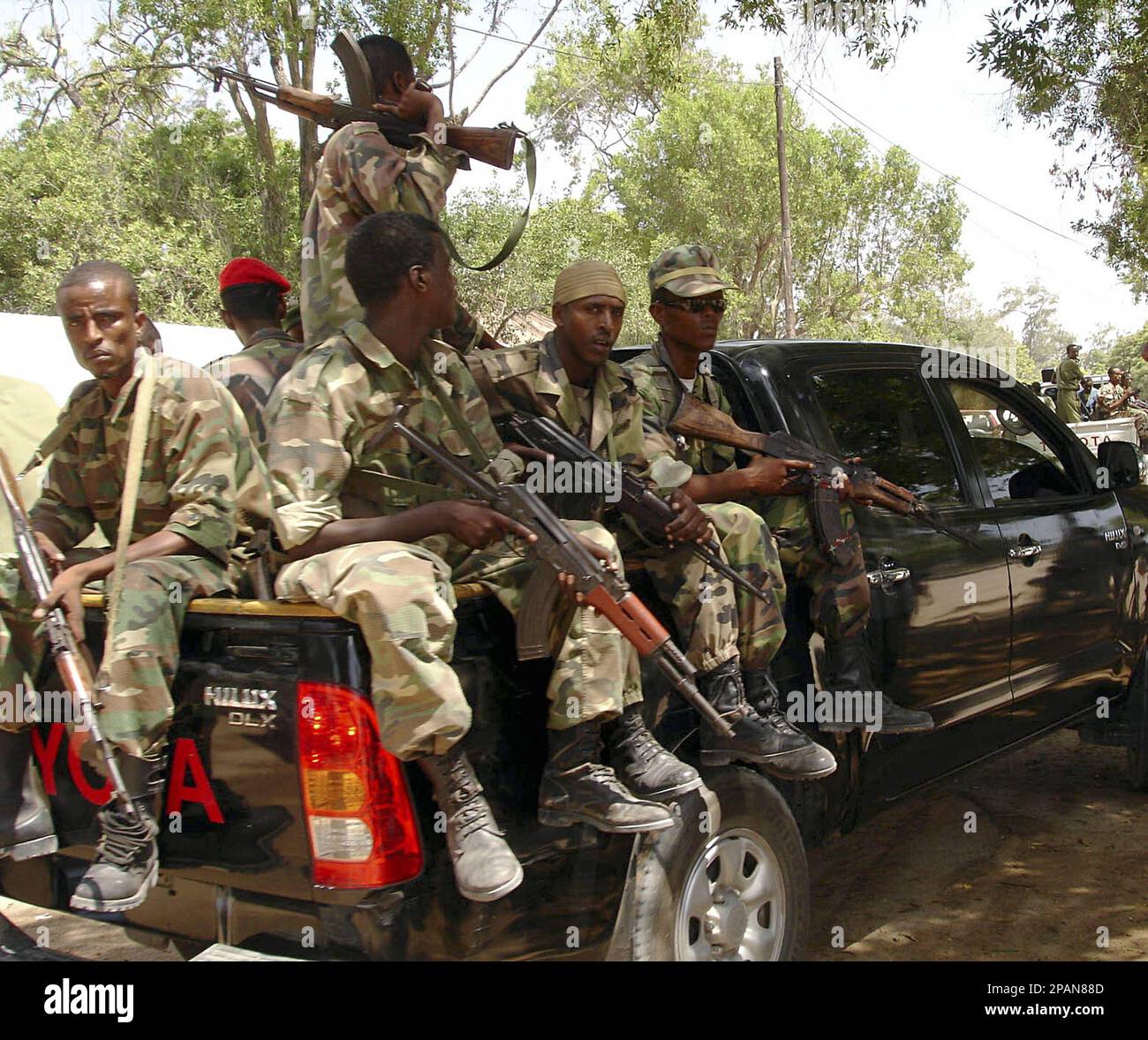 Somali forces on an armed pick up truck stand guard, during a parade at ...