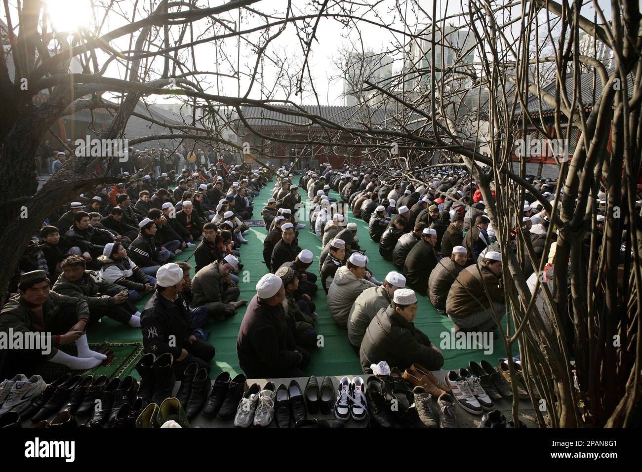 Chinese Muslim men take part in gathering for the celebration of the ...