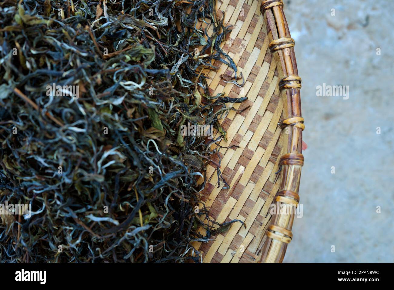 Green Tea leaves drying in a wicker basket Stock Photo - Alamy