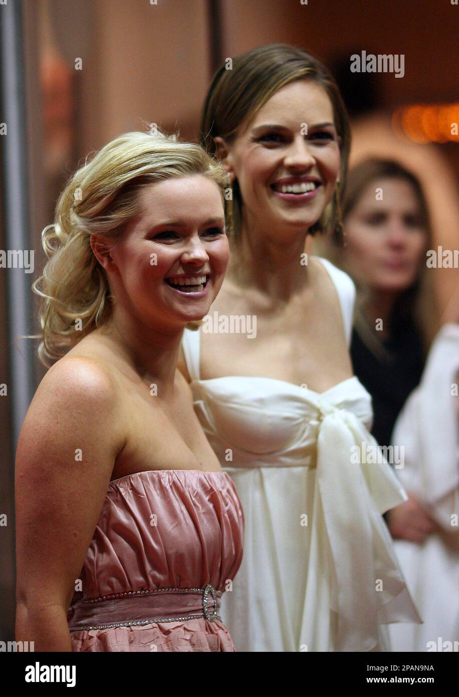 U.S. Actress Hilary Swank, right, arrives with Irish author Cecelia ...
