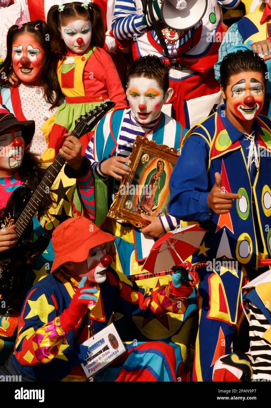 Mexican clowns pose for a photo at the Basilica of Guadalupe in Mexico ...