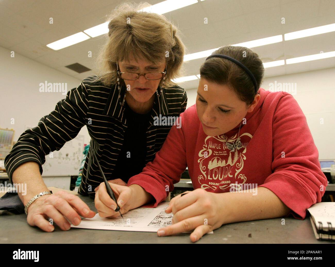 Professor Carol Tyler, left, works with student Emily Williams in a ...