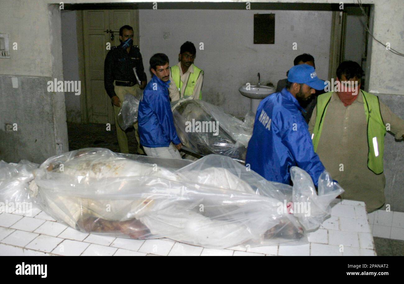 The dead body, bottom, of famous Pakistani painter Ismail Gulgee lies ...