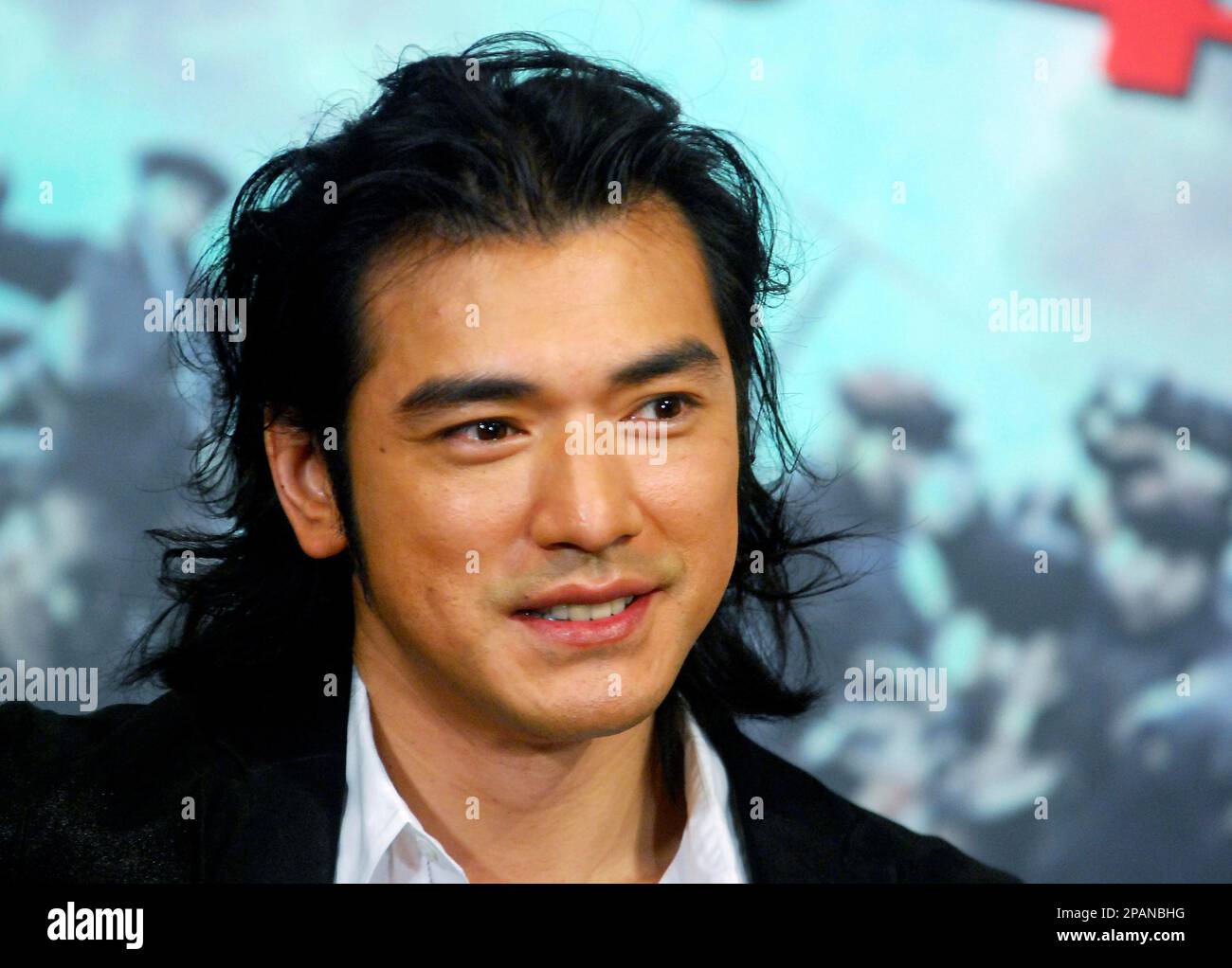 Japanese actor Takeshi Kaneshiro smiles during a news conference to ...