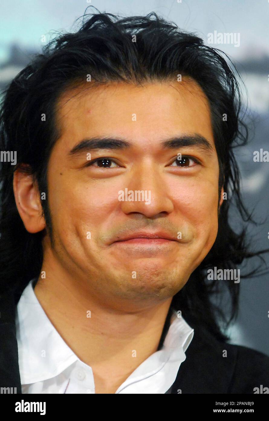 Japanese actor Takeshi Kaneshiro smiles during a news conference to ...