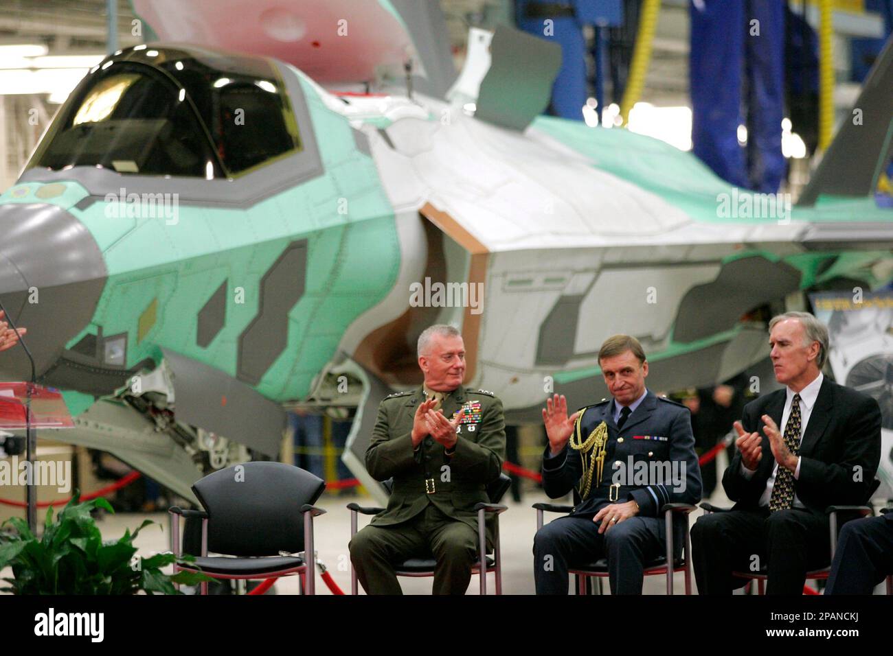 Air Marshal Sir Barry Thornton, center, from the United Kingdom, waves ...