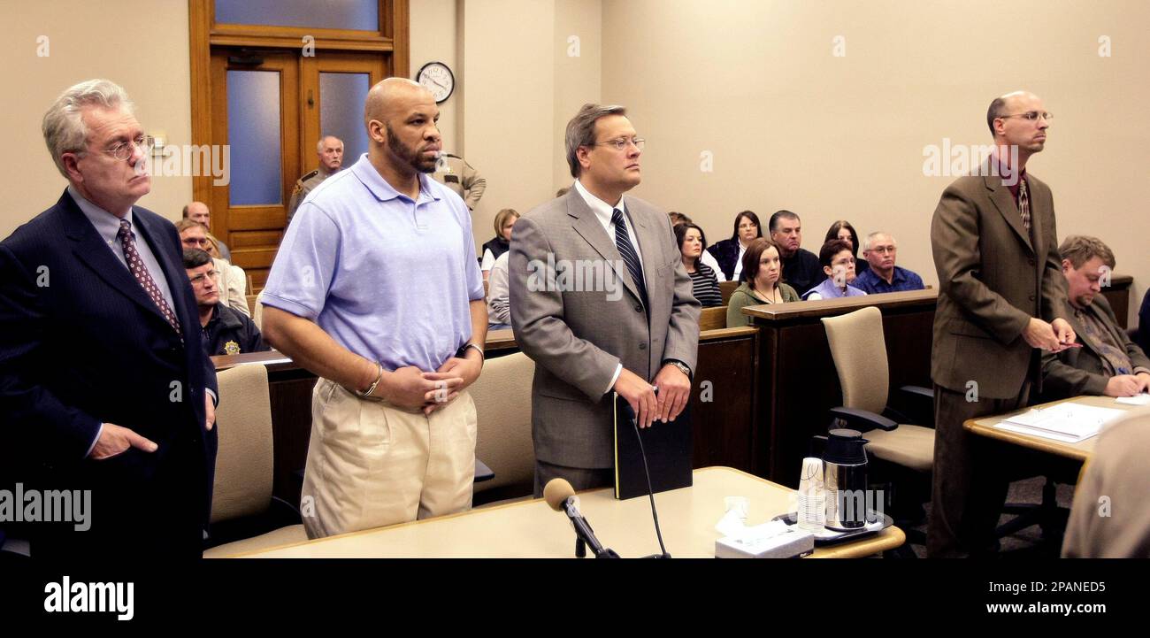 Moe Gibbs, second left, stands between defense attorneys Dennis Fisher ...