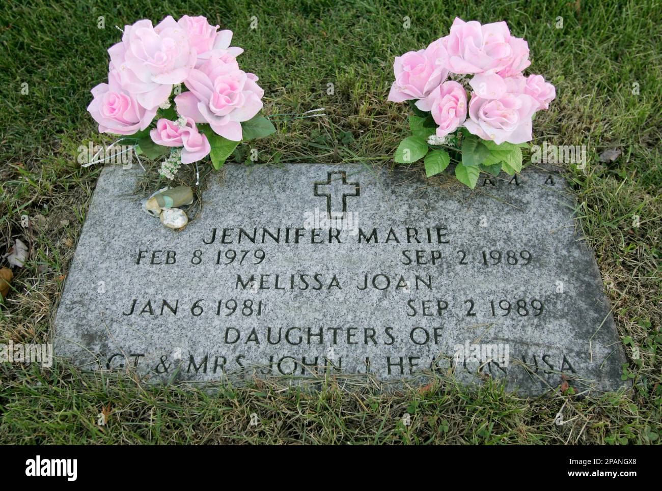 **ADVANCE FOR SUNDAY, DEC. 16** The gravestone for sisters Jennifer and ...