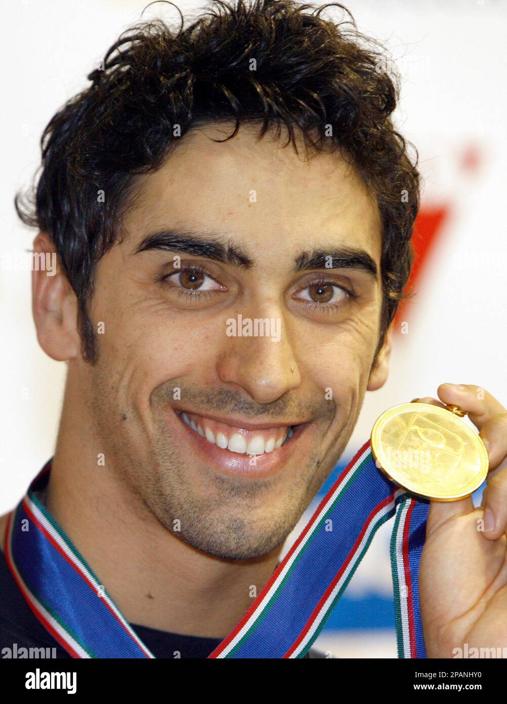 Italy's gold medalist Felippo Magnini poses with his medal after the ...
