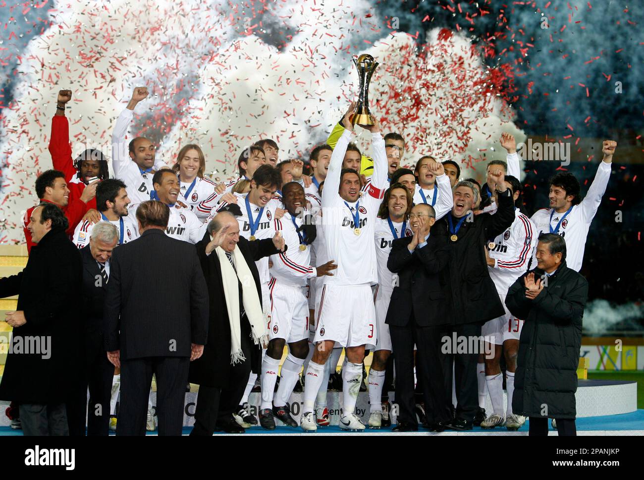 Captain Paolo Maldini Holds Up The Trophy As Ac Milan Players Celebrate