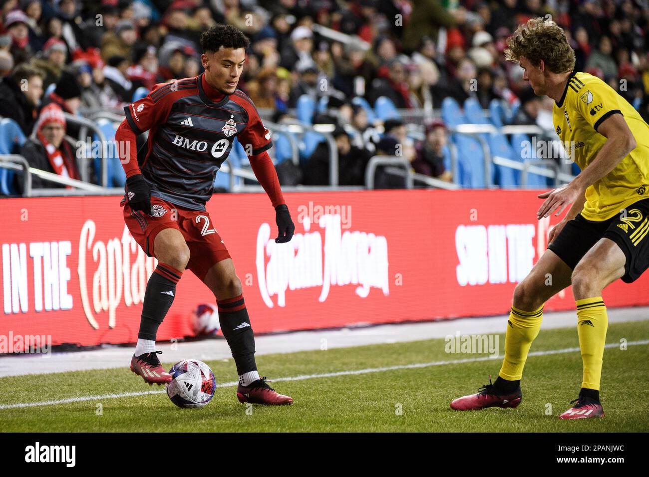Toronto FC midfielder Brandon Servania (23) is defended by Columbus ...