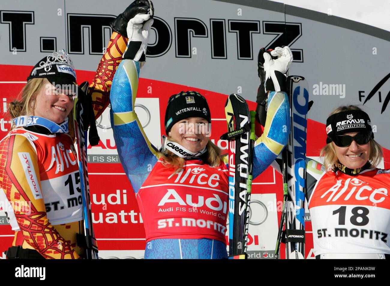 Winner Anja Paerson from Sweden, center, celebrates on the podium with ...