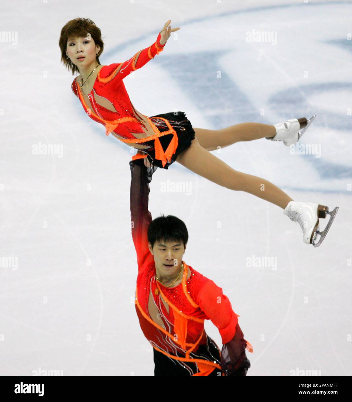 China's Dan Zhang is lifted up by her partner Hao Zhang perform on ...