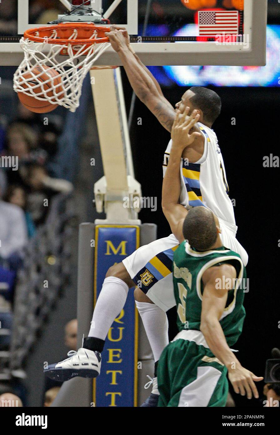 Marquette's Dominic James dunks the ball over Sacramento State's ...