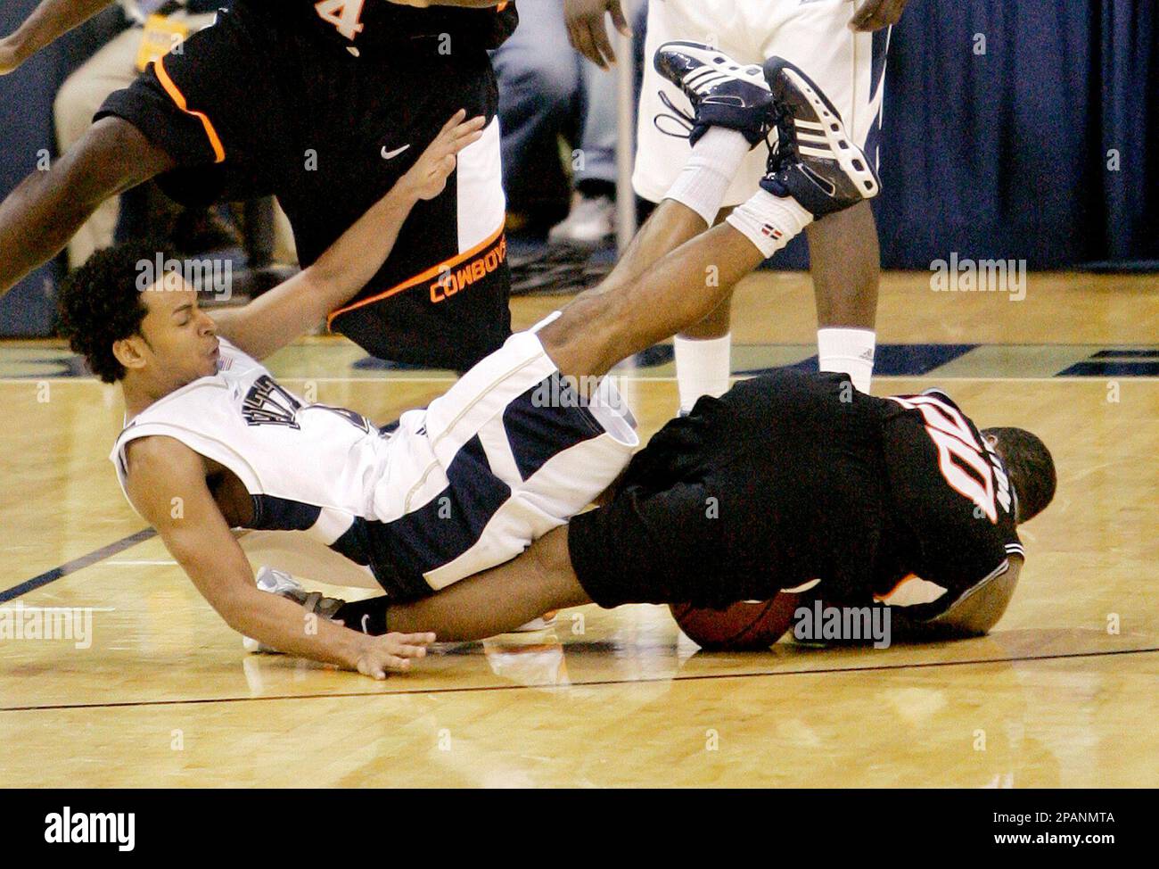 Pittsburgh's Ronald Ramon, left and Oklahoma State's Byron Eaton ...