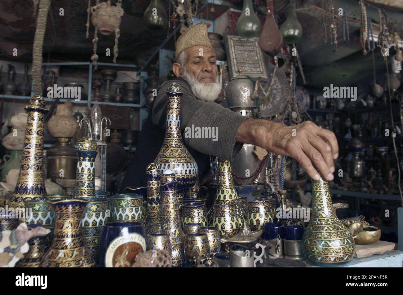 Sultan Ahmad, an Afghan shopkeeper, who sells antique and unique items ...