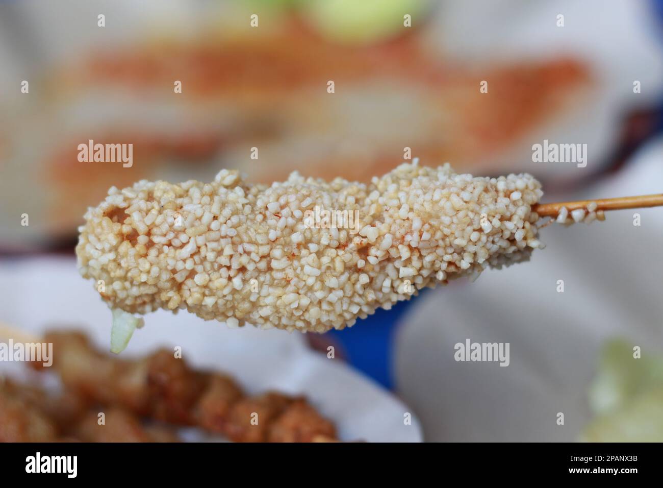 photo of chicken satay breaded and served with red chili sauce ...