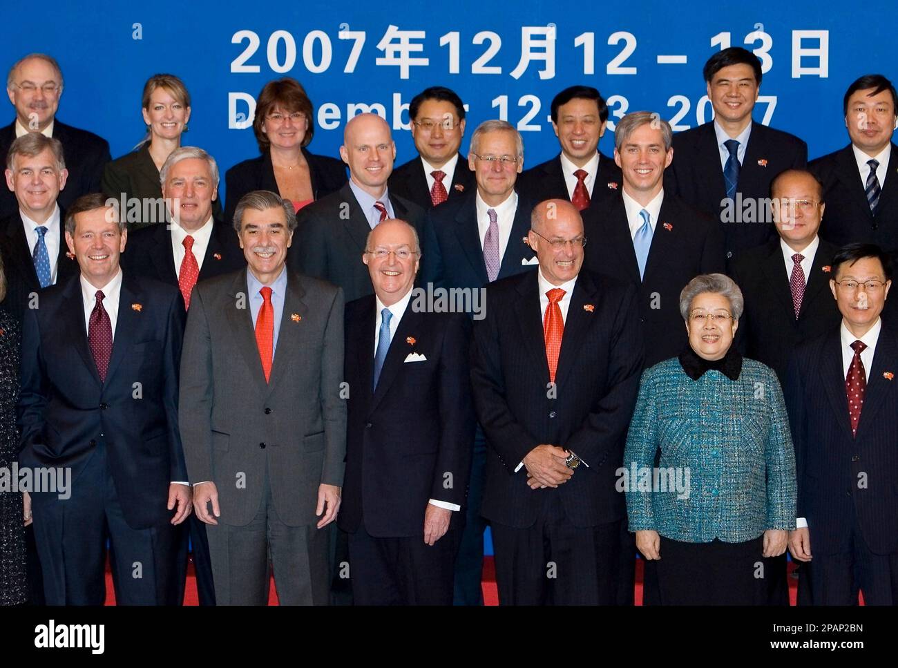 Chinese Vice Premier Wu Yi, from foreground second right, stands with U ...