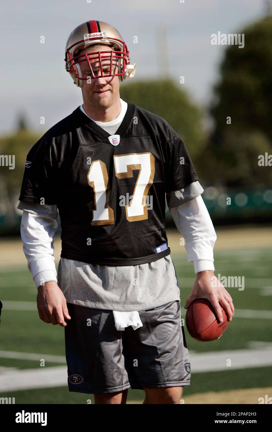 New San Francisco 49ers quarterback Chris Weinke (17) walks off the ...