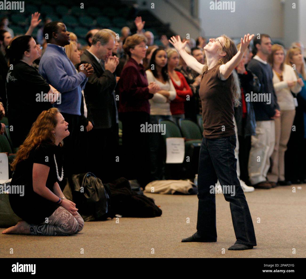 Family and friends pray during a memorial service for Tiffany Ann ...