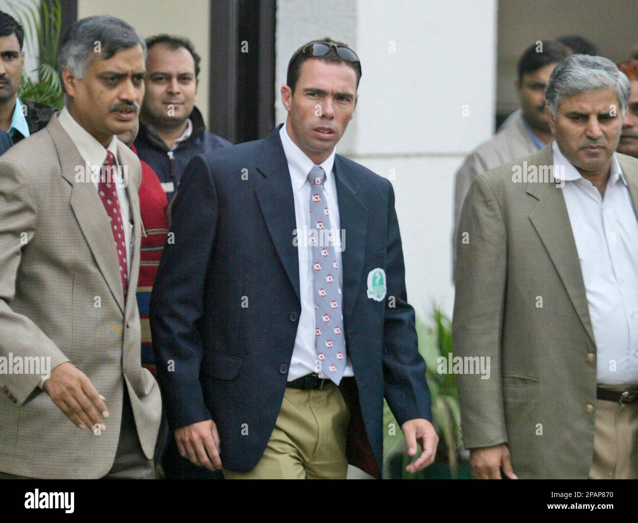 South African cricketer Nicky Boje, center, leaves a police station ...