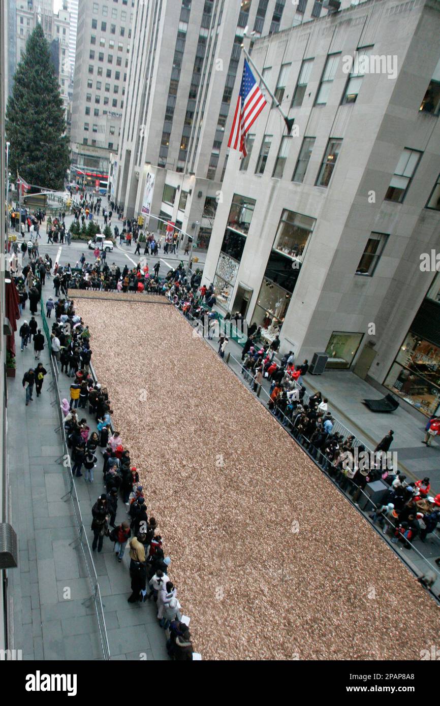 Children who helped collect pennies surround the "Penny Harvest Field ...