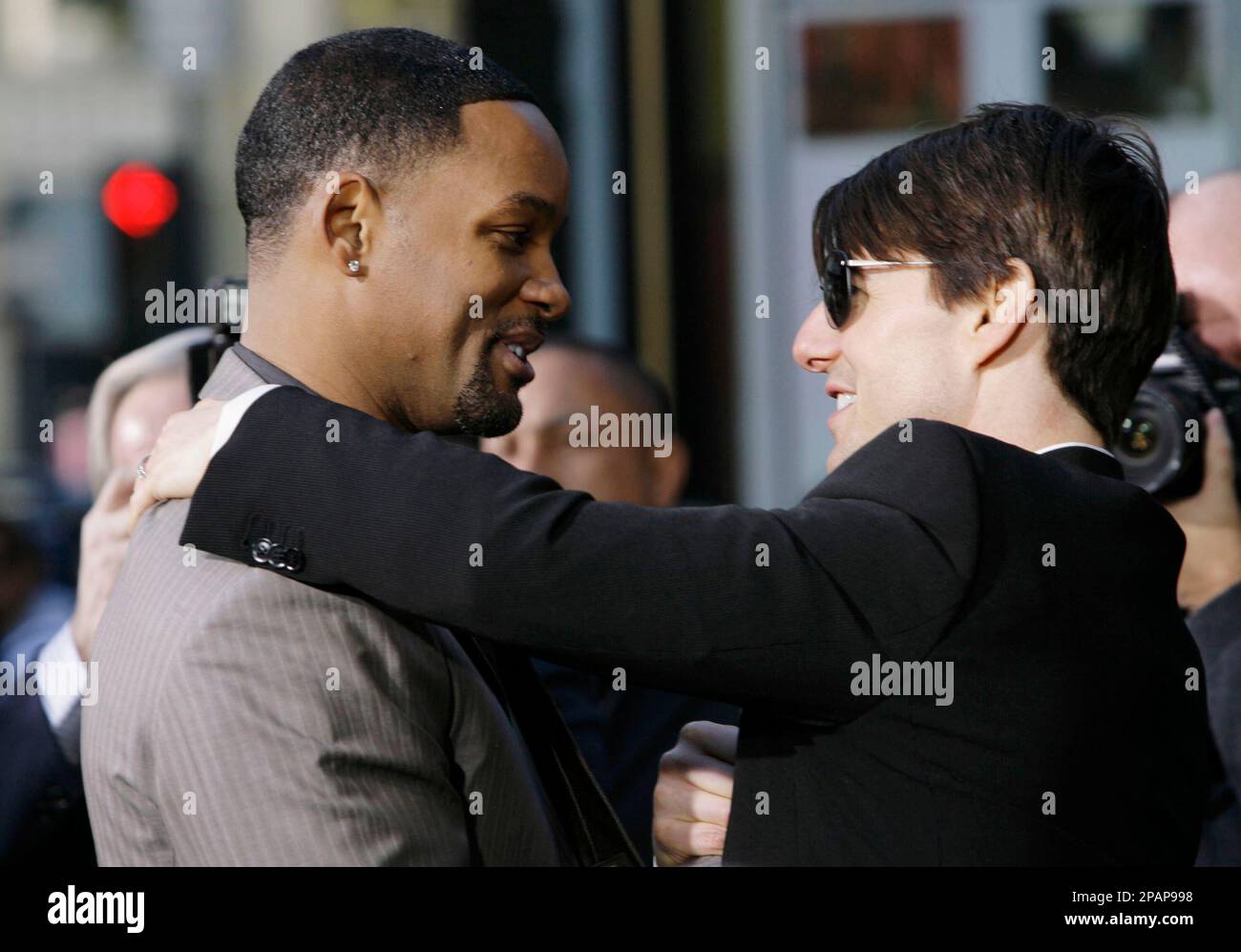 Actor Will Smith, star of "I Am Legend," shakes hands with actor Tom ...