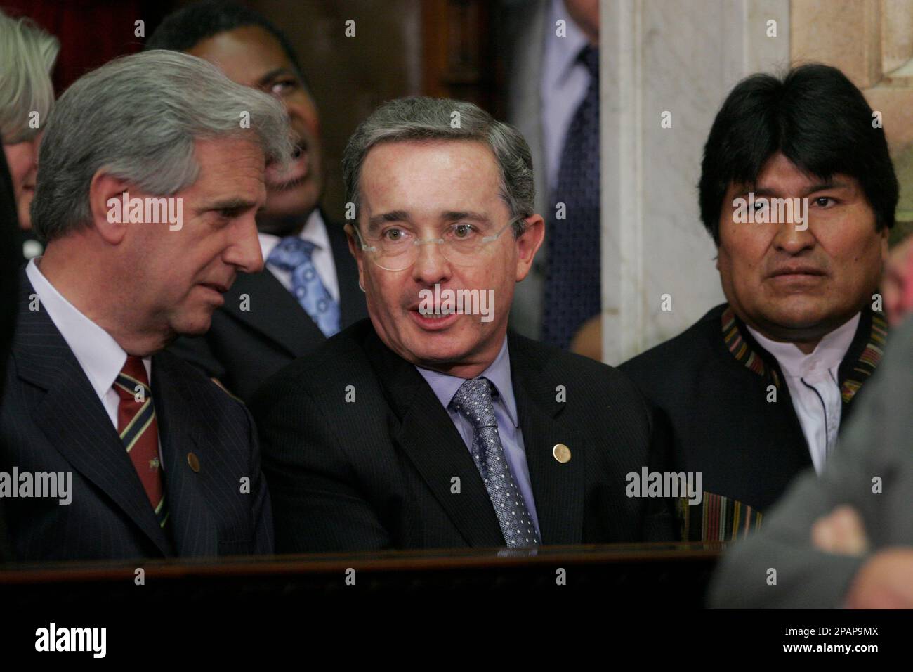 Uruguay's President Tabare Vazquez, left, listens to Colombia's President Alvaro Uribe, center ...