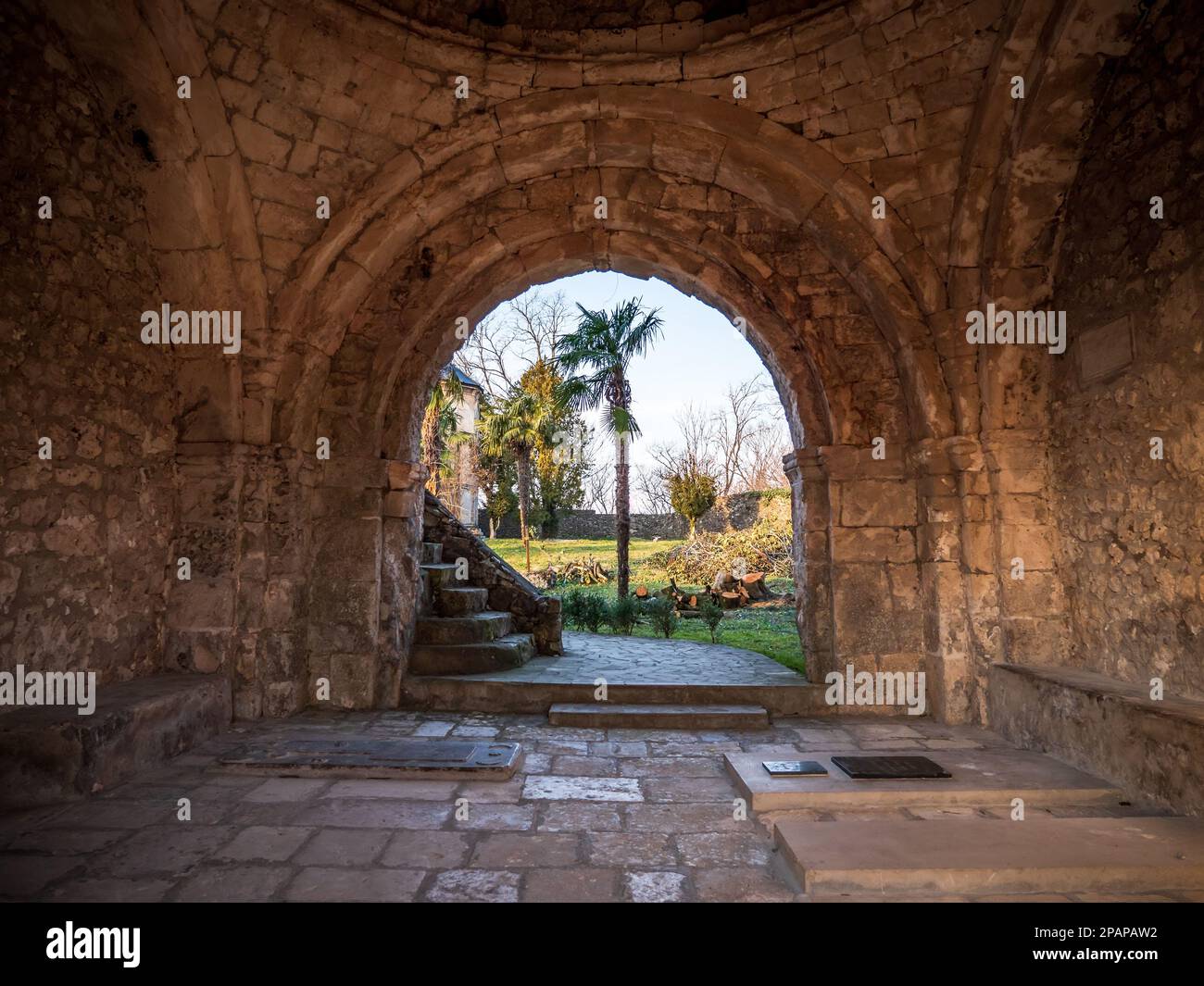 Ancient religious building made of stone with an arched passage in ...