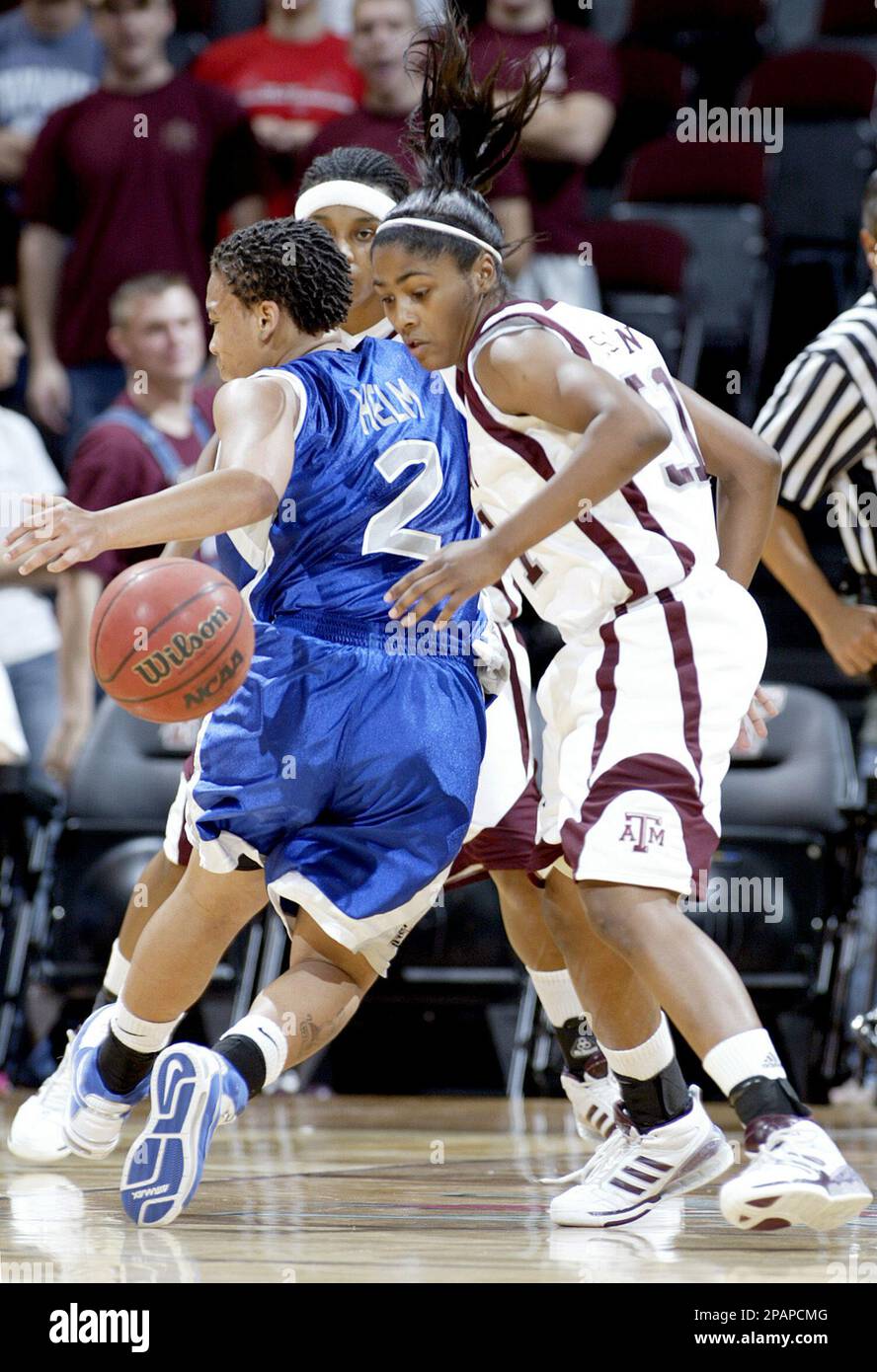 Texas A&M's Sydney Colson, right, looks for the ball after stripping it ...