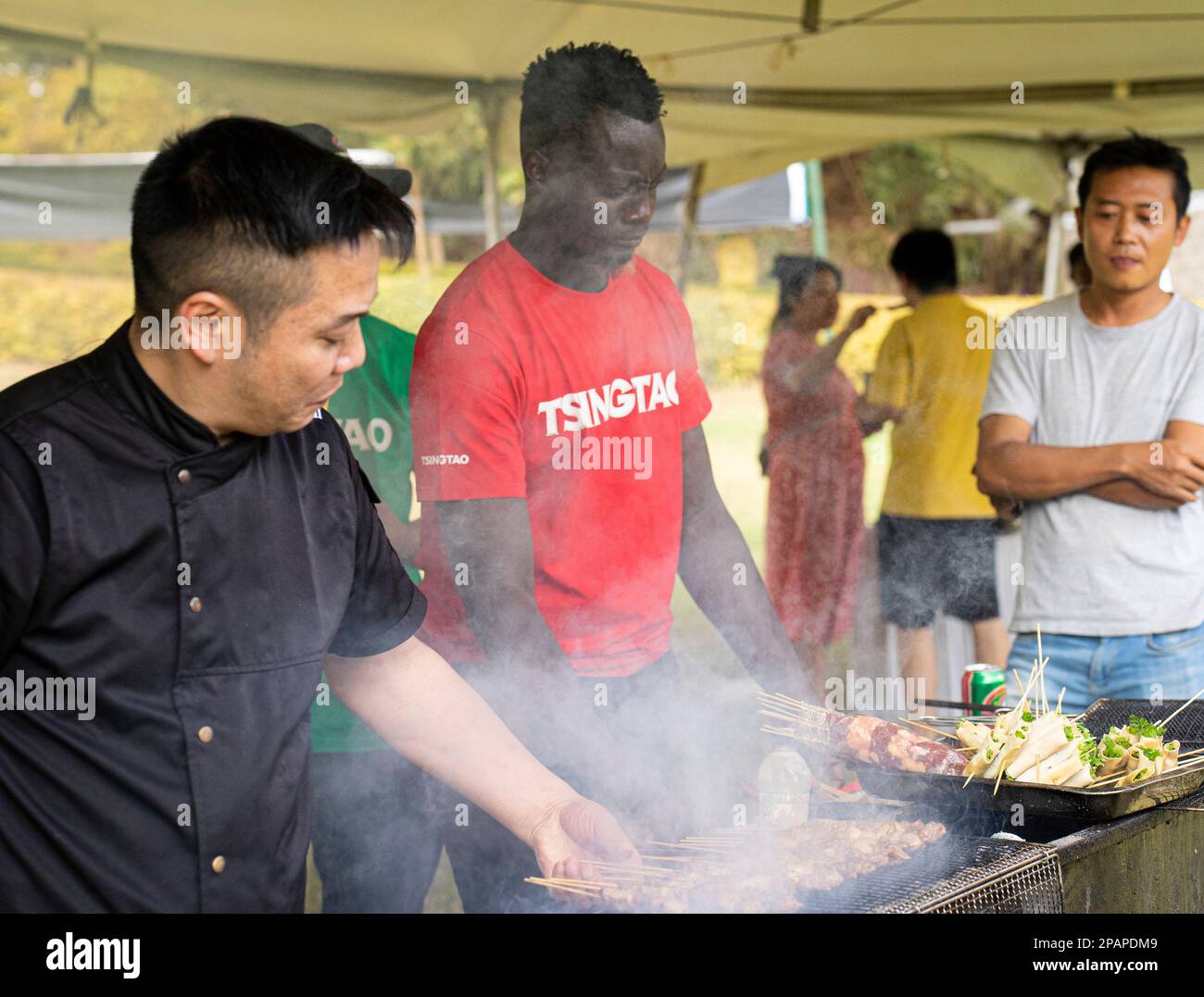 Nairobi, Kenya. 11th Mar, 2023. A worker cooks barbecue for visitors ...