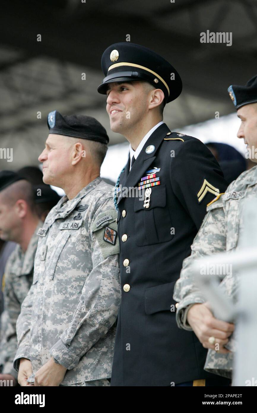 Spc. Alejandro "Alex" H. Albarran, Jr. watches his wives graduation ...