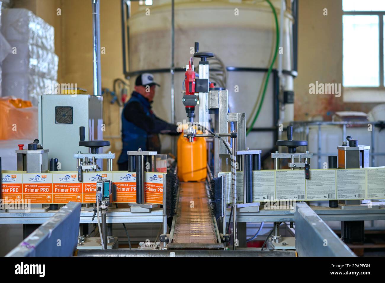 paint bottling line at the factory Stock Photo - Alamy