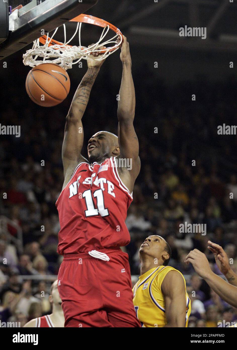 North Carolina's State's Gavin Grant (11) dunks the ball over East ...