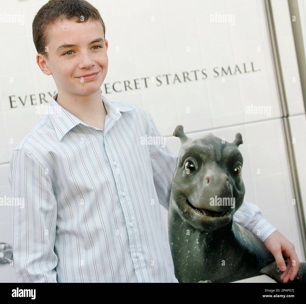 Actor Alex Etel poses with a paper water horse cutout on the press line ...
