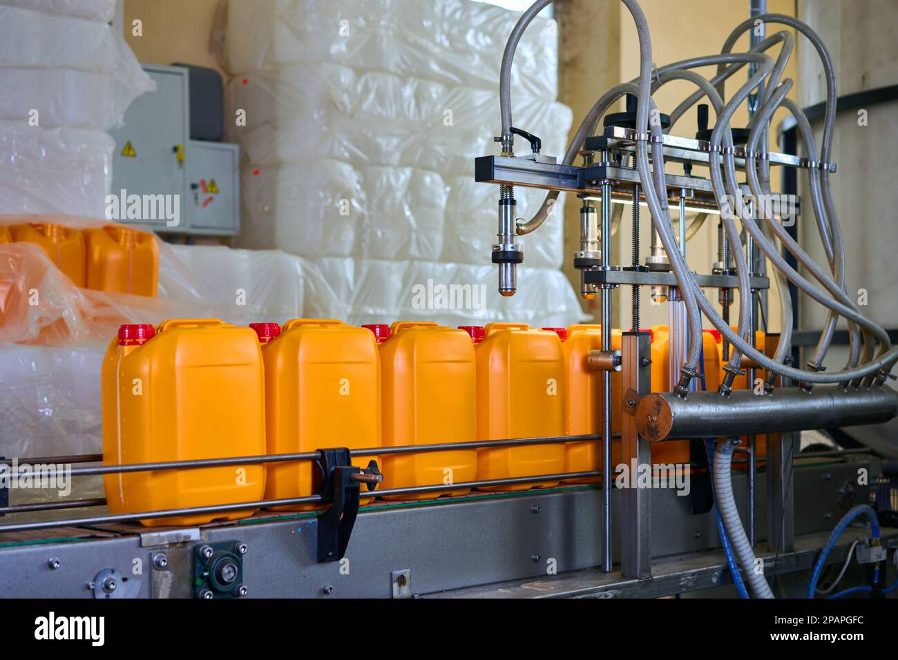 paint bottling line at the factory Stock Photo - Alamy