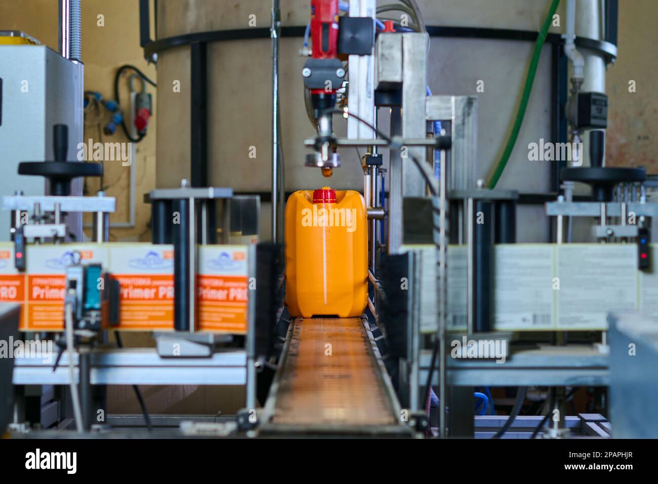 paint bottling line at the factory Stock Photo - Alamy