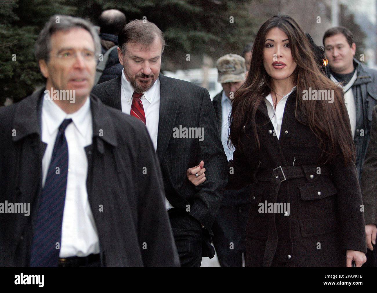 Former Alaska state lawmaker Pete Kott, center left, walks with his ...