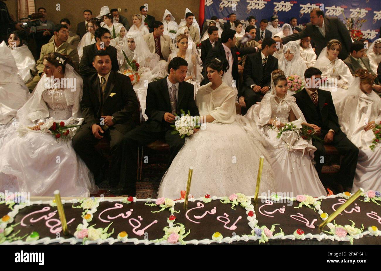 Newly married couples attend a party at the Palestine Hotel in Central ...