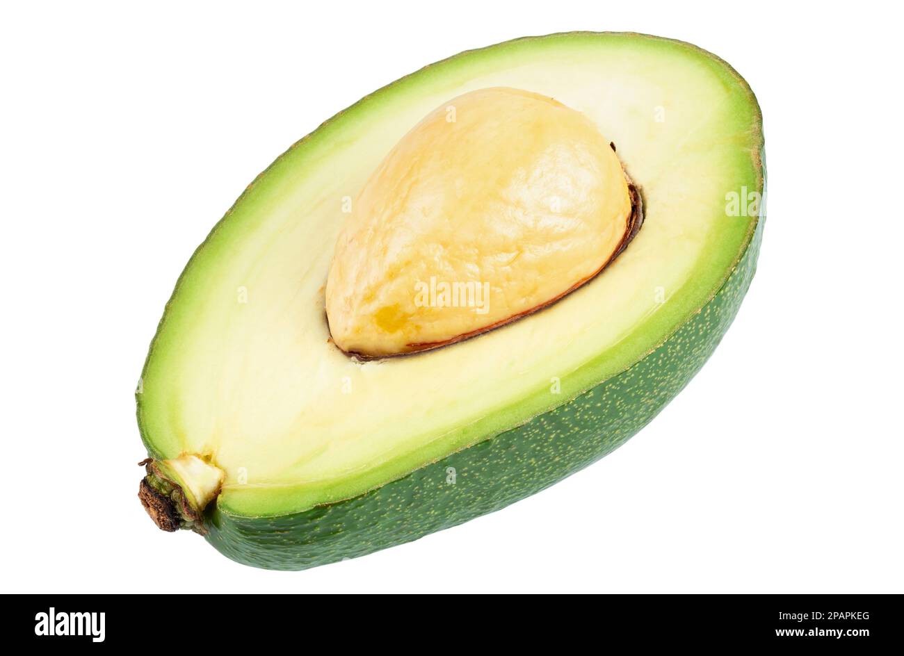 Avocado cut in half with bone isolated on white. Fresh vegetables. File ...