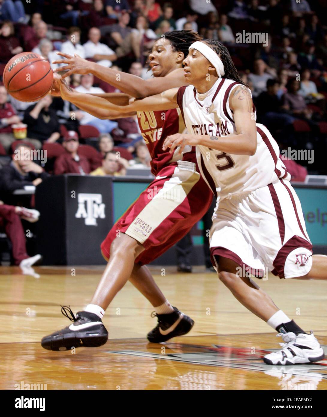Texas A&M's Takia Starks, left, goes for the steal on an inbound pass ...